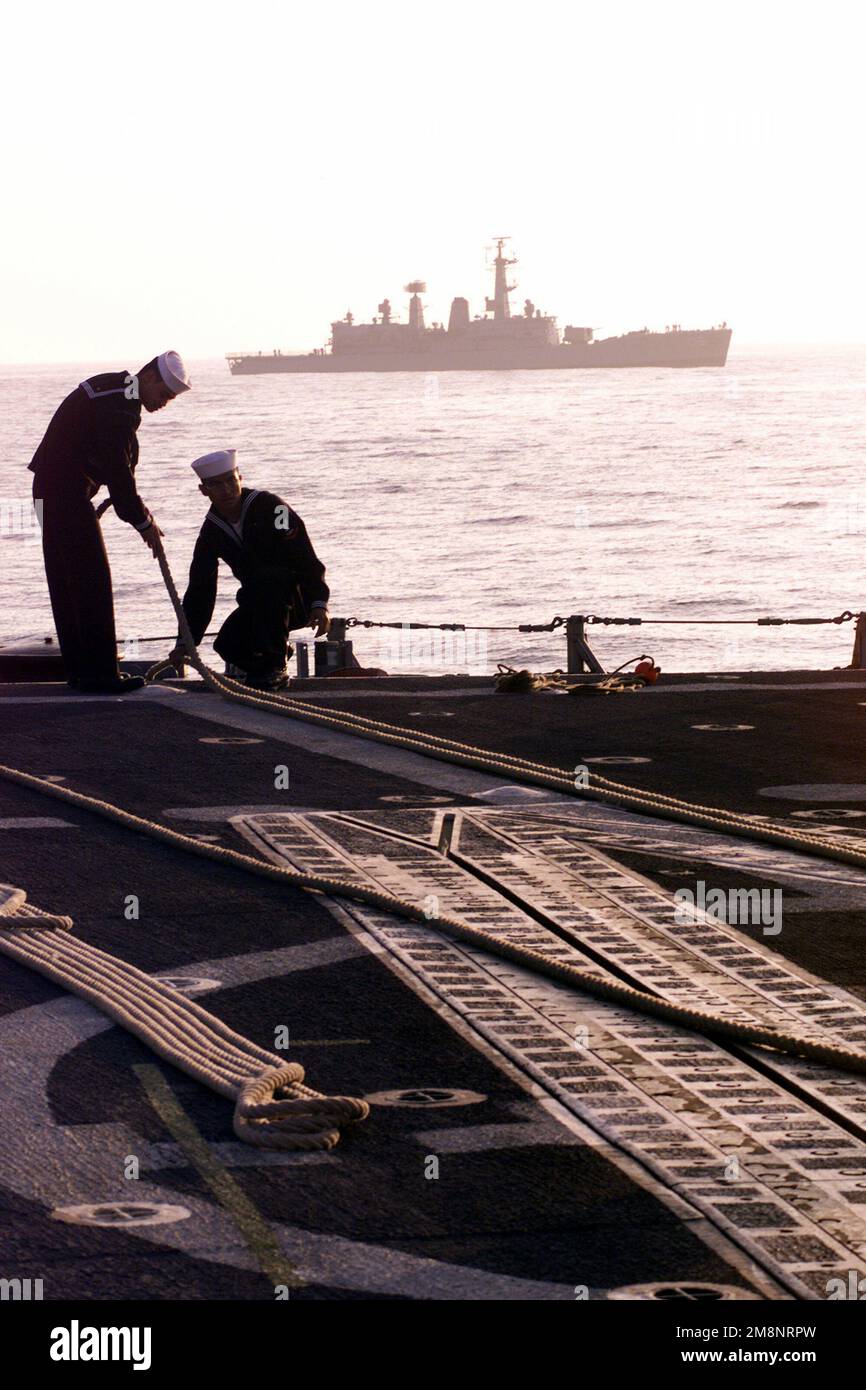 Sailors aboard USS REUBEN JAMES (FFG 57) take out their lines on the ...