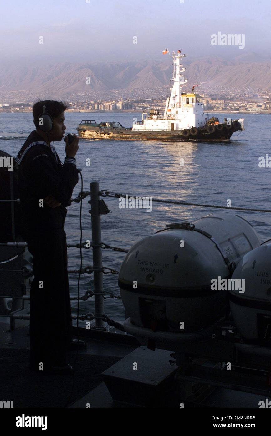 US Navy SEAMAN Don Consolacion stands his post as phone talker aboard ...