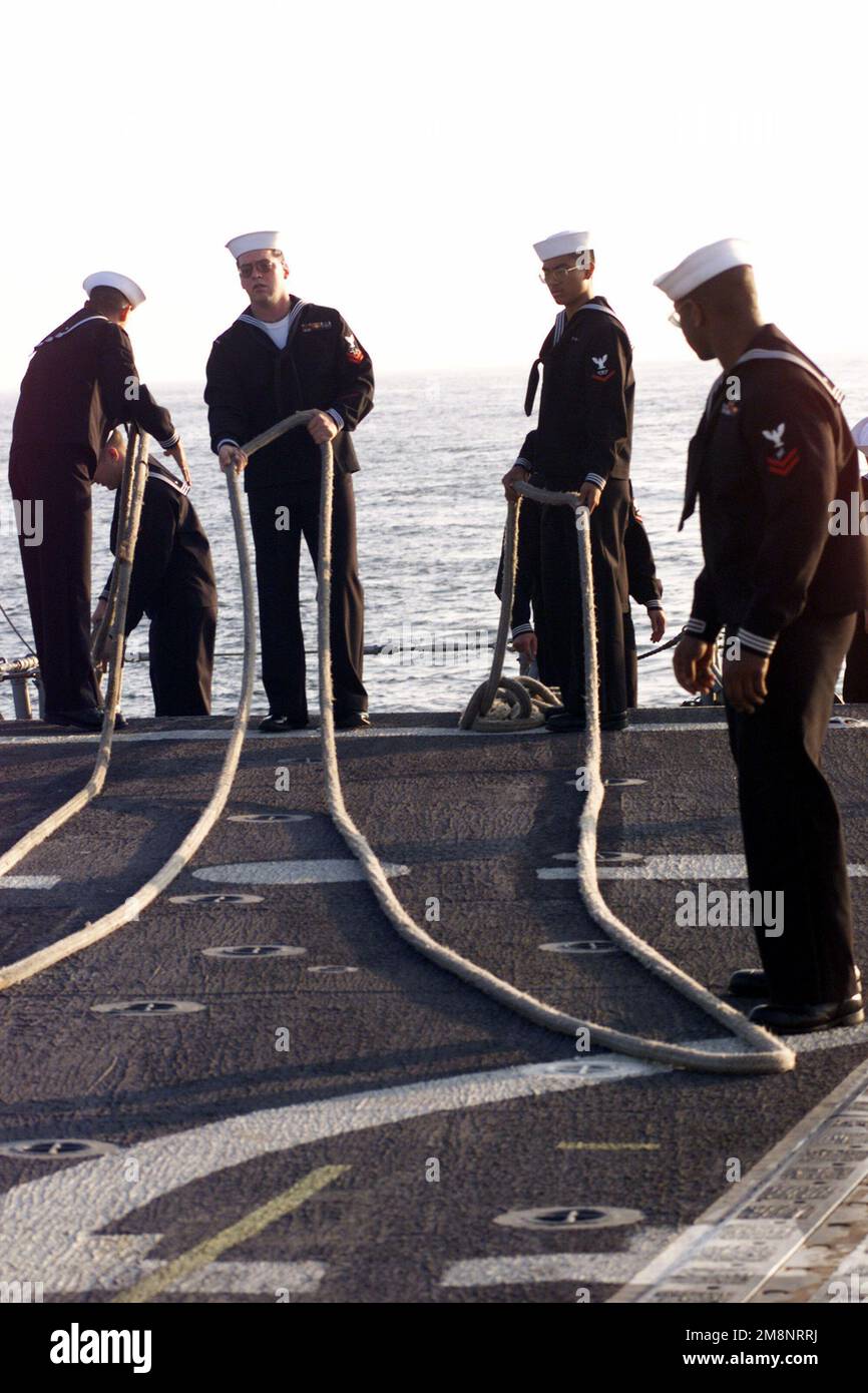 Sailors aboard USS REUBEN JAMES (FFG 57) fake out their lines on the ...