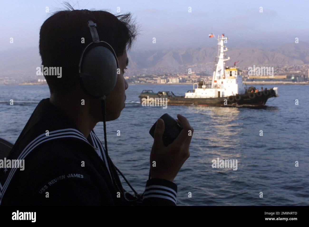 US Navy SEAMAN Don Consolacion stands his post as a phone talker aboard ...