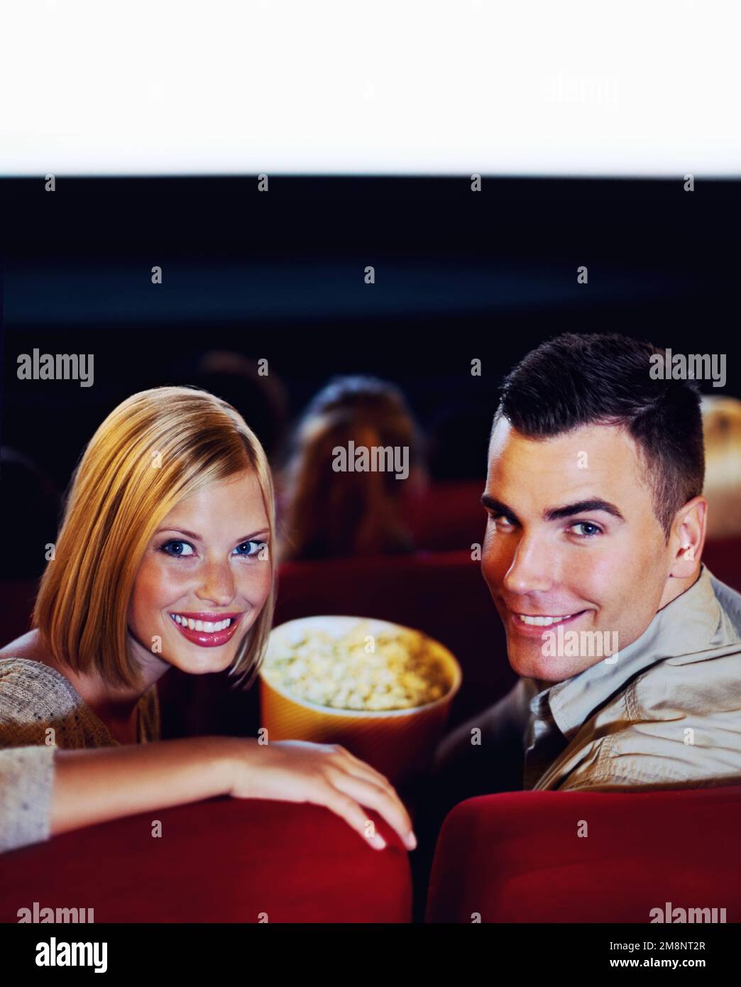 Our first date. A cute young couple smiling while on a date at the ...