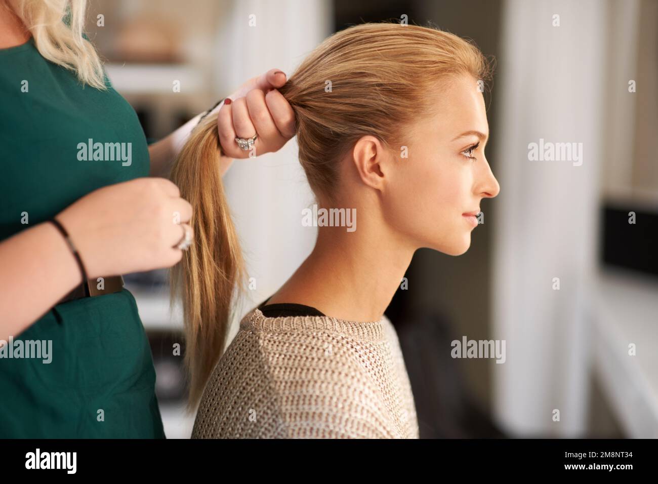 Two women at the hairdresser getting their hair done hi-res stock ...