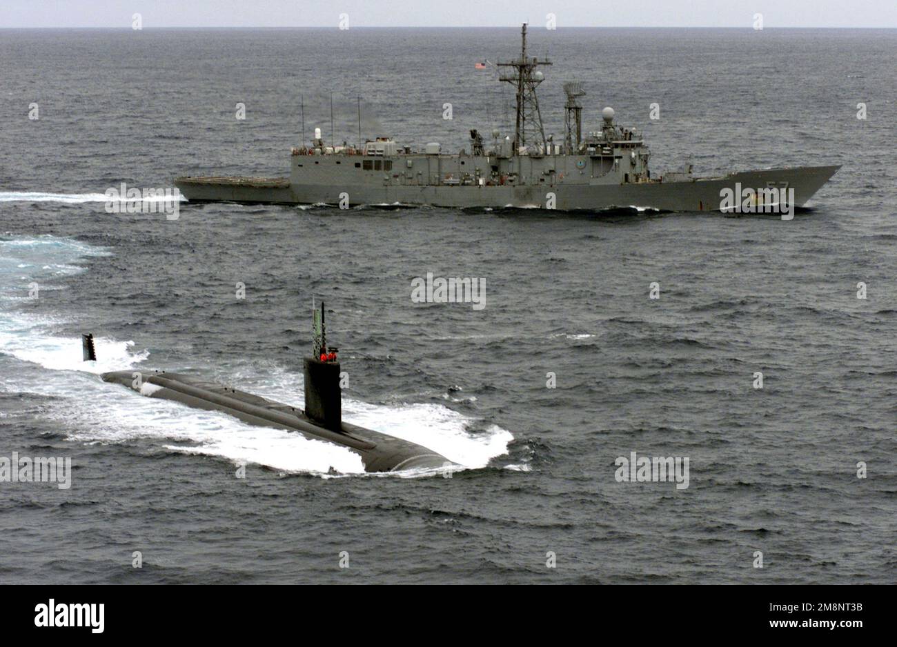 USS REUBEN JAMES (FFG 57) (top) and USS TUCSON (SSN 770) (bottom) as ...