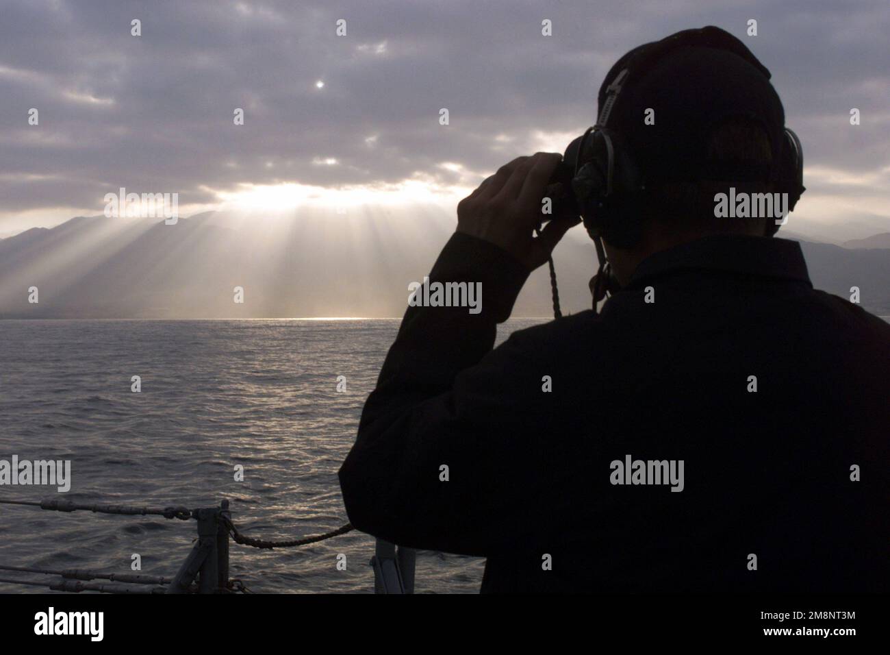 US Navy SEAMAN Sam Devaldo stands the aft look out aboard USS REUBEN ...