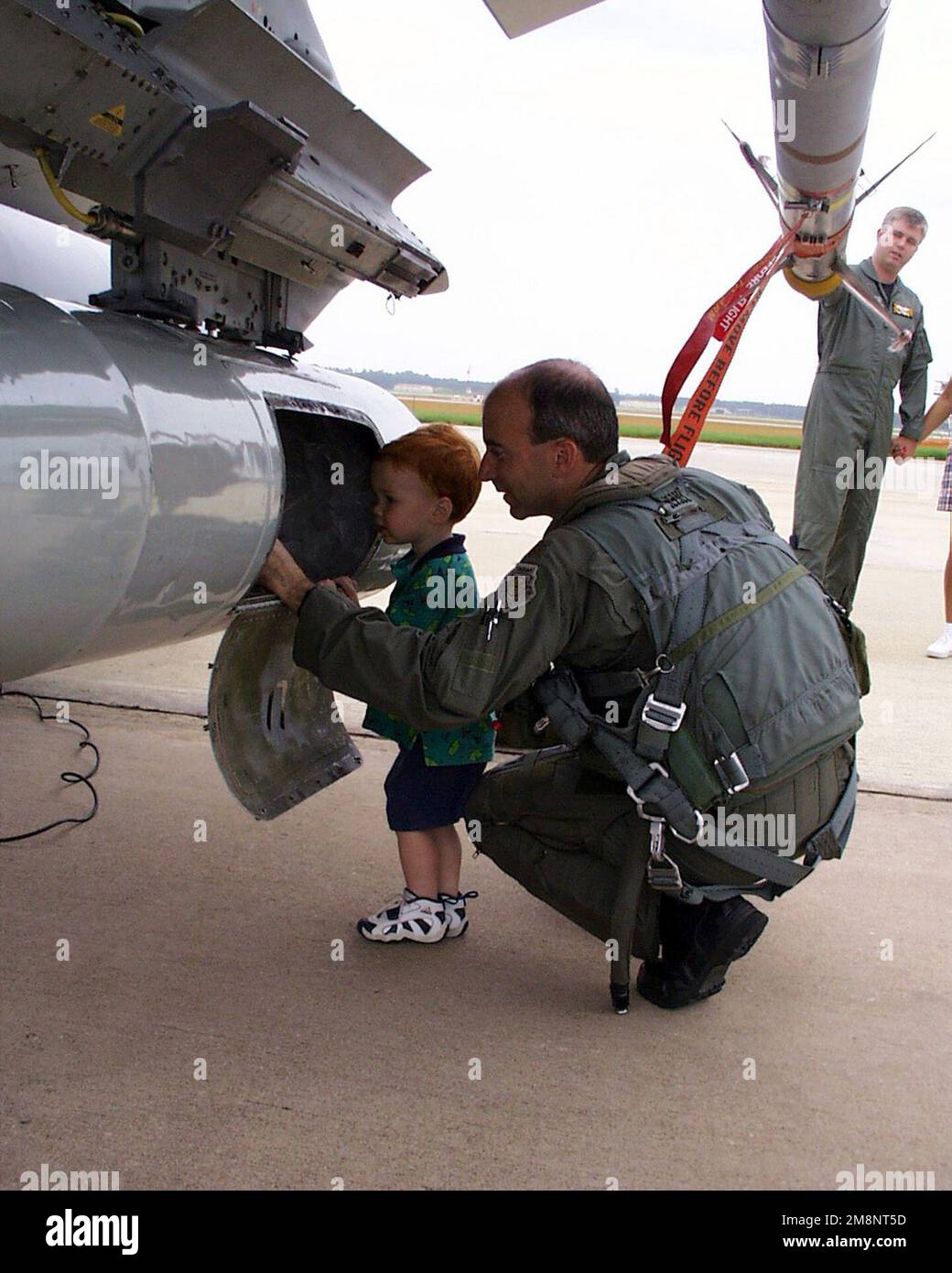 Major John Fyfe shows his son Trevor the plane Daddy flies, an F-16CJ ...