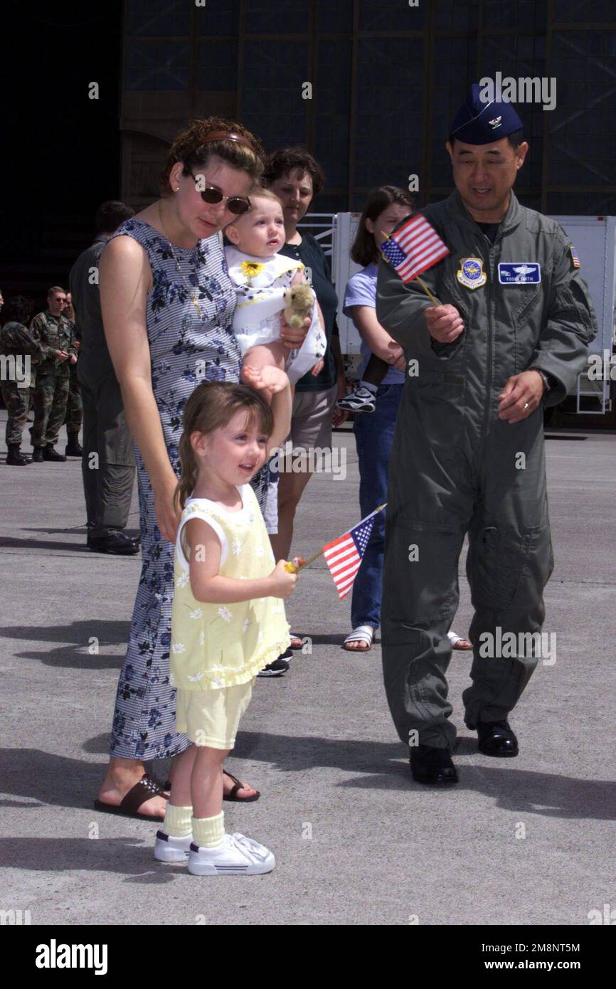 Colonel Yoshio Smith, 92 Air Refueling Wing Commander, stands with ...