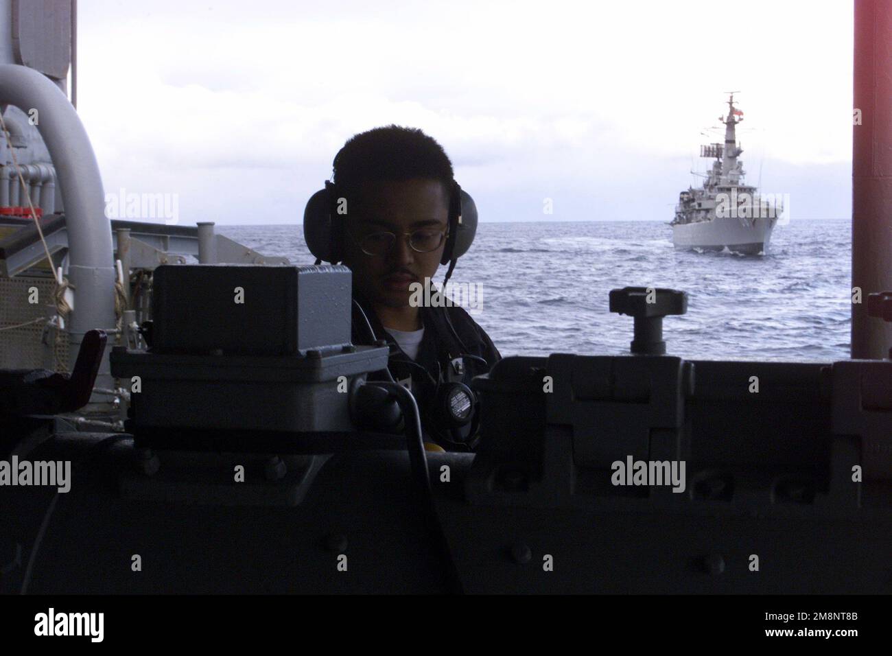 US Navy Torpedoman 3rd Class Remus Feliciano mans an MK32 mod15 Surface ...