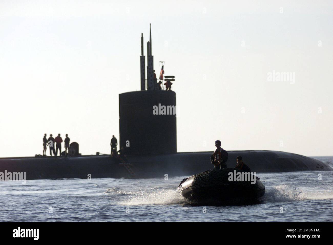 A Zodiac inflatable raft departs USS TUCSON (SSN 770) while off the ...