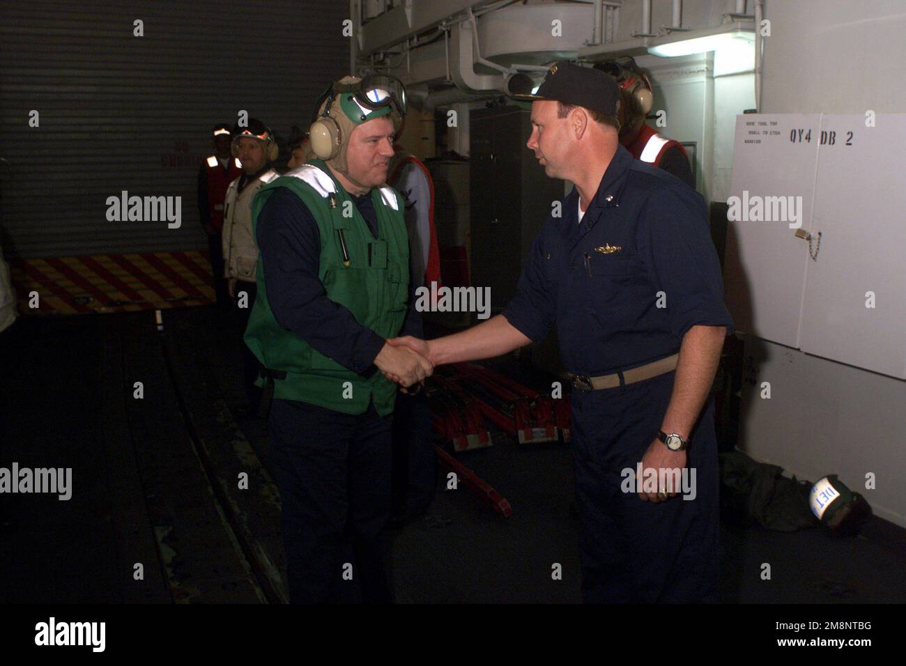 US Navy Commander Steven L. Richter (right), Commanding Officer of USS ...