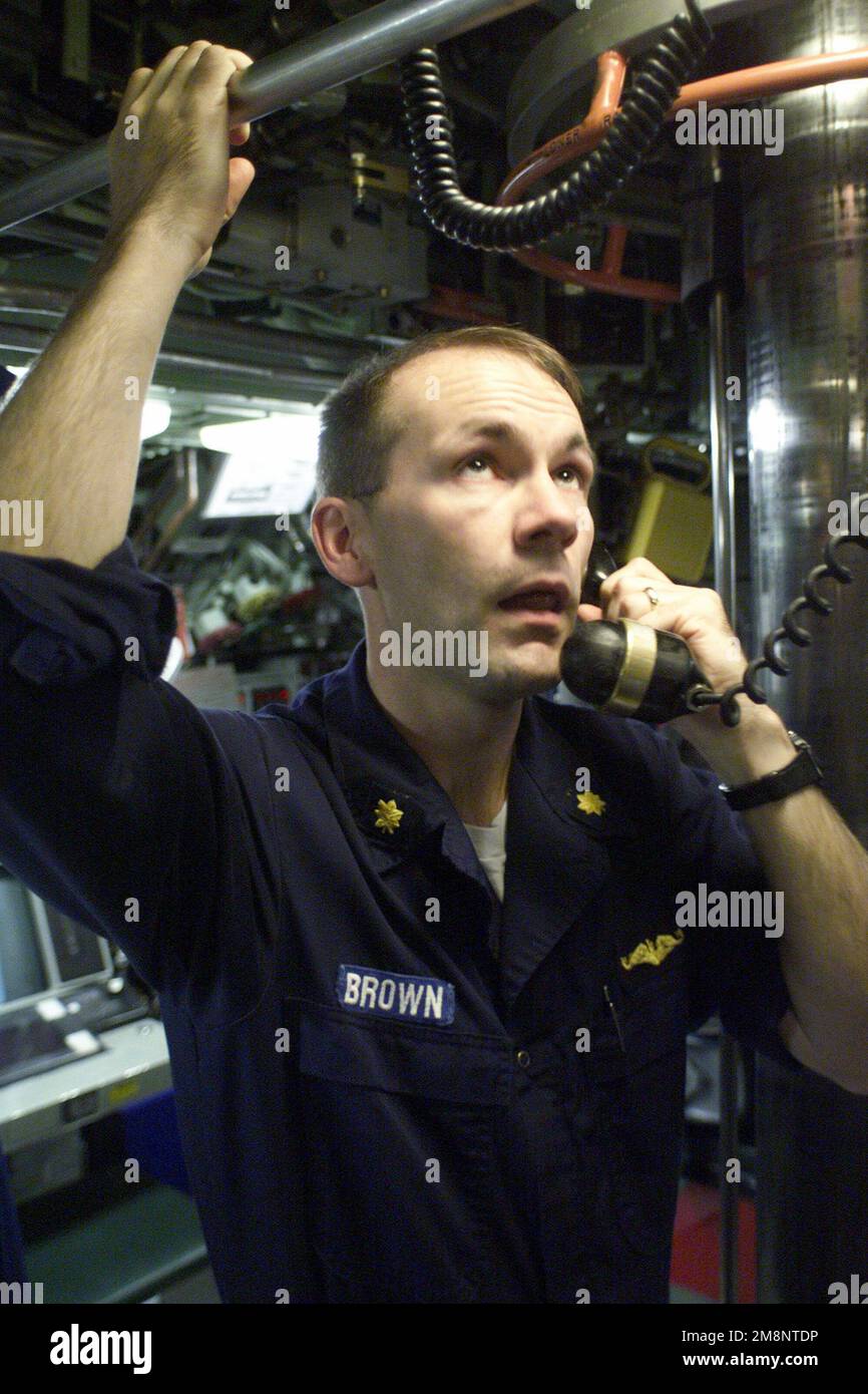 US Navy Lieutenant Commander Don Brown, navigator, mans his station in ...