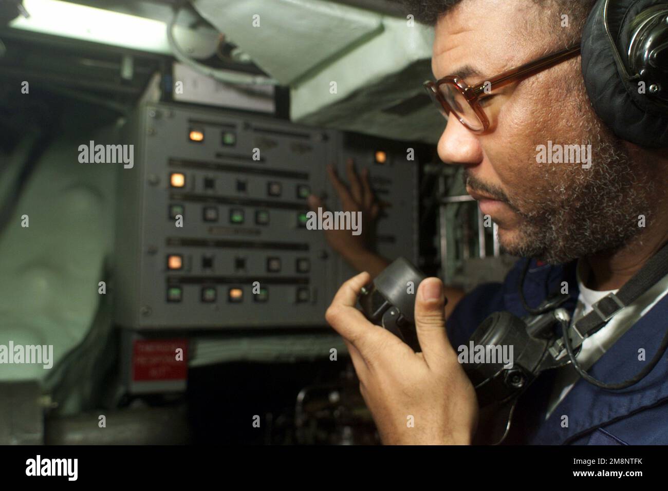 US Navy Torpedoman First Class James Johnson prepares a 3-inch launcher ...
