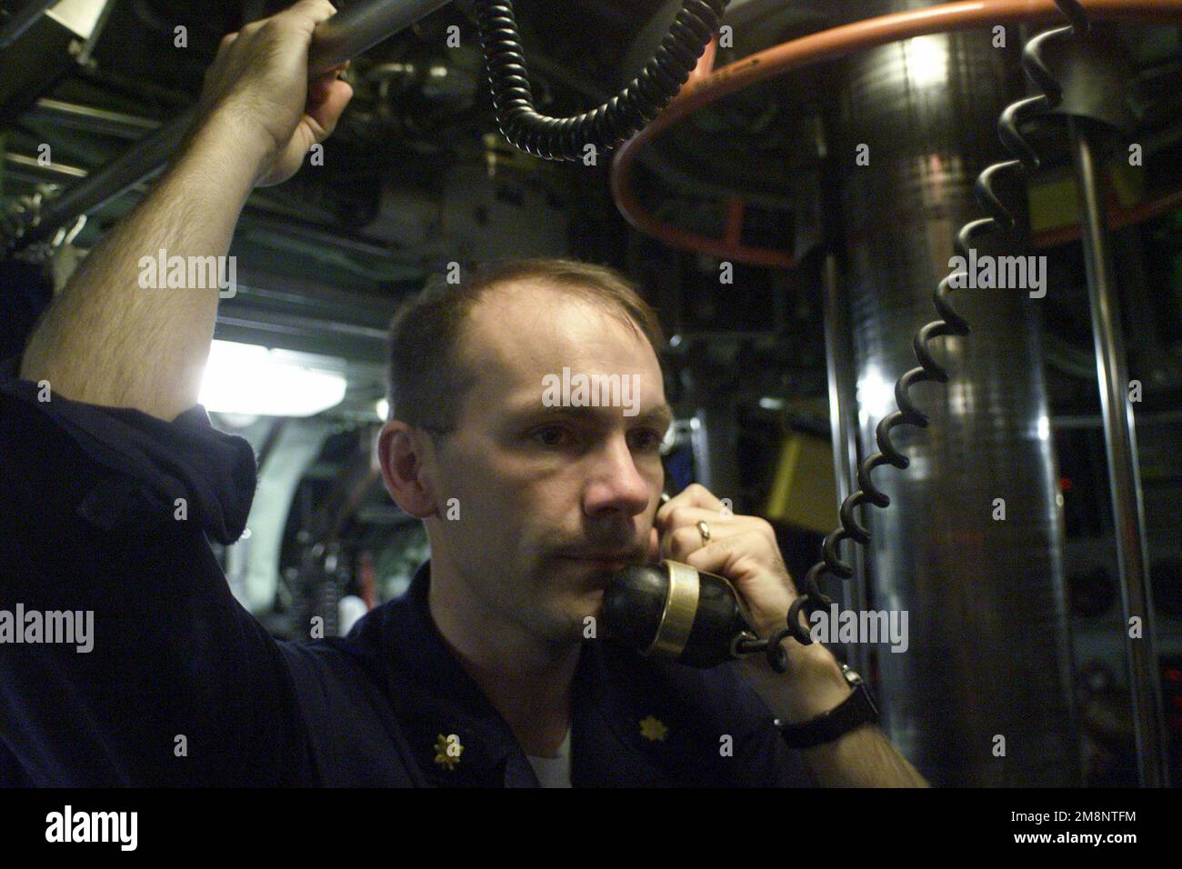 US Navy Lieutenant Commander Don Brown, navigator, mans his station in ...