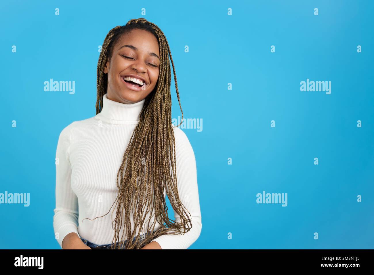 Happy african woman with braids closing the eyes Stock Photo - Alamy