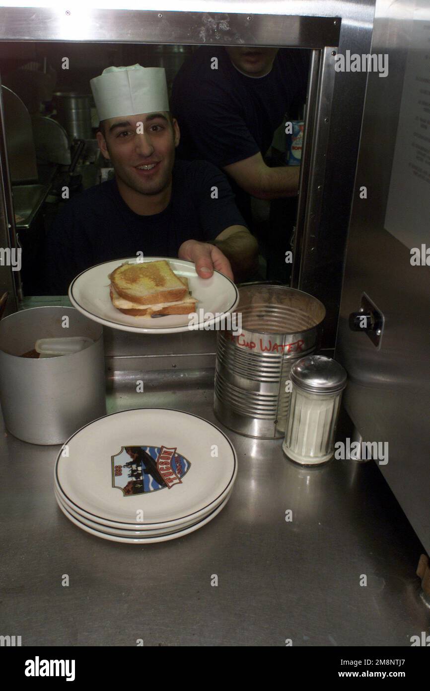 US Navy Mess SPECIALIST SEAMAN Cary Schiff serves up Monte-Cristo ...