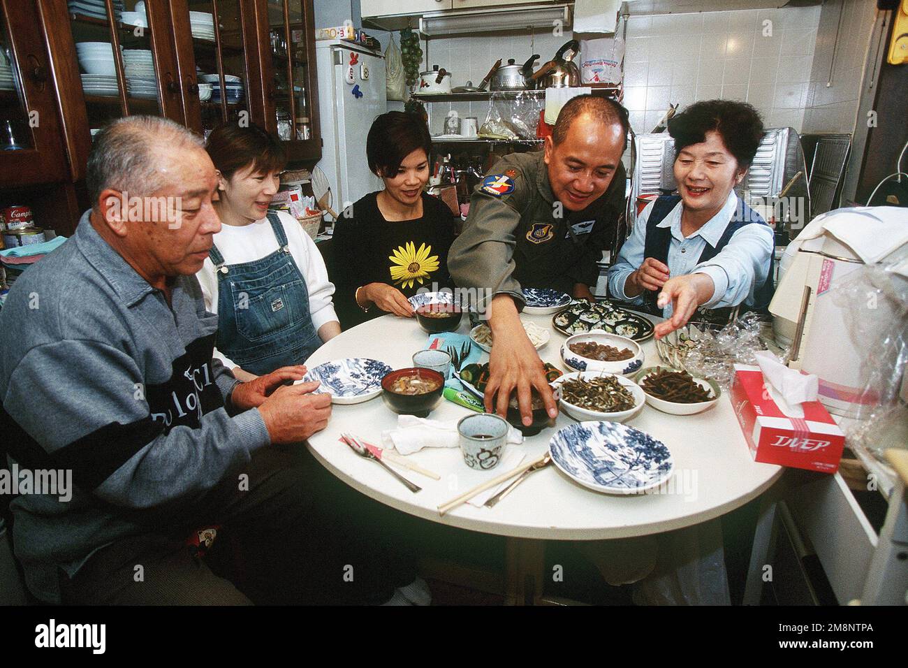 US Air Force Major Manny Martin and his wife, Nenette (wearing black ...