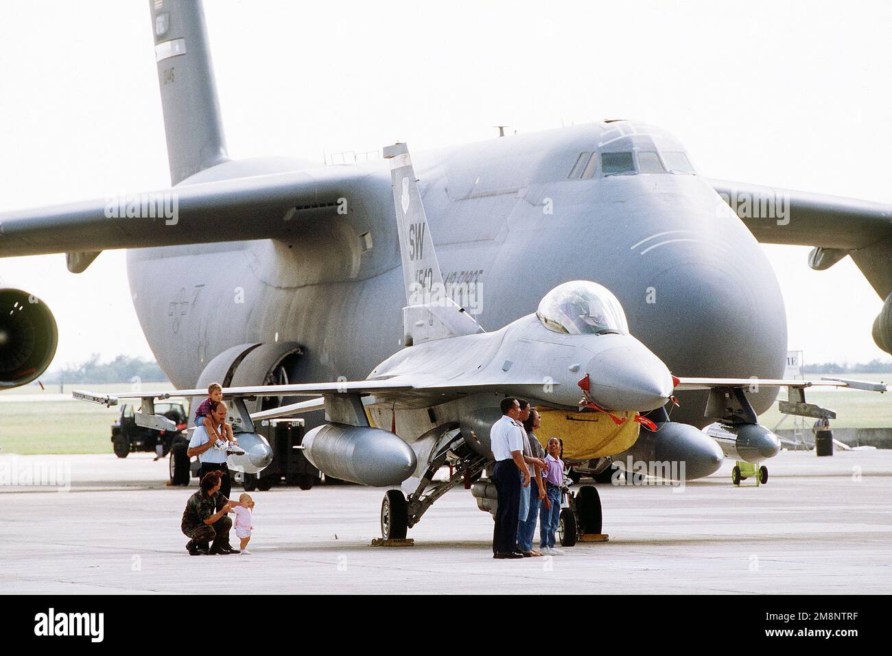 Air Force families tour the Kelly AFB ramp area where a gigantic C-5 ...