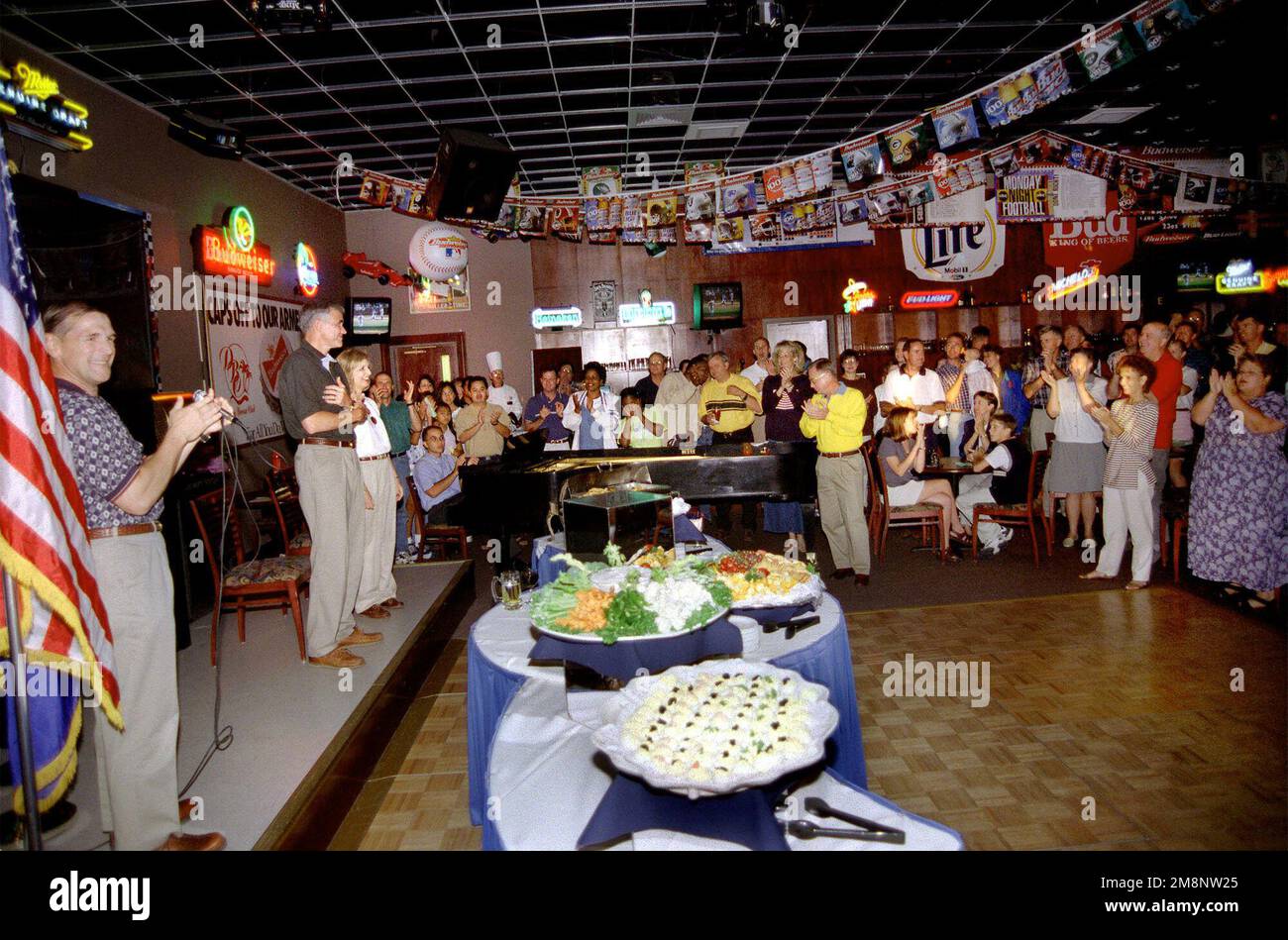 Medium long shot, it was standing room only at the Delta Breeze Club as ...