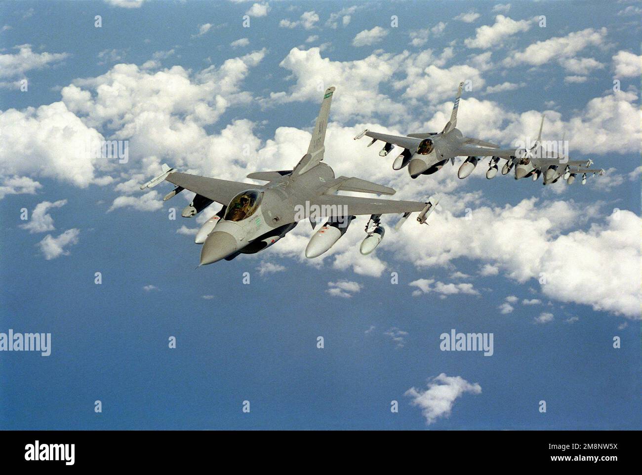 Left side front view medium aerial shot as US Air Force F-16's from ...