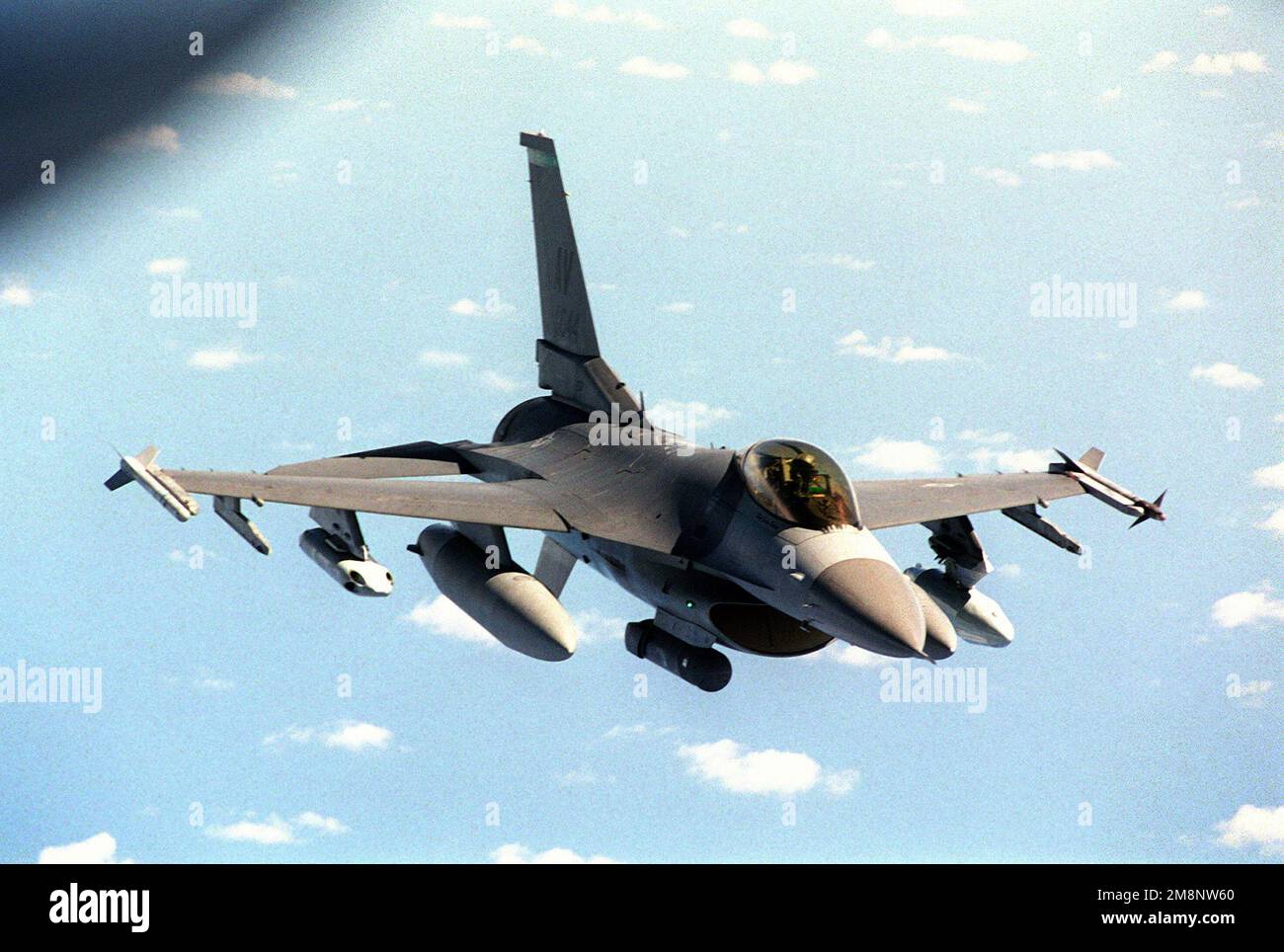 Right side front view medium aerial shot as a US Air Force F-16 from ...