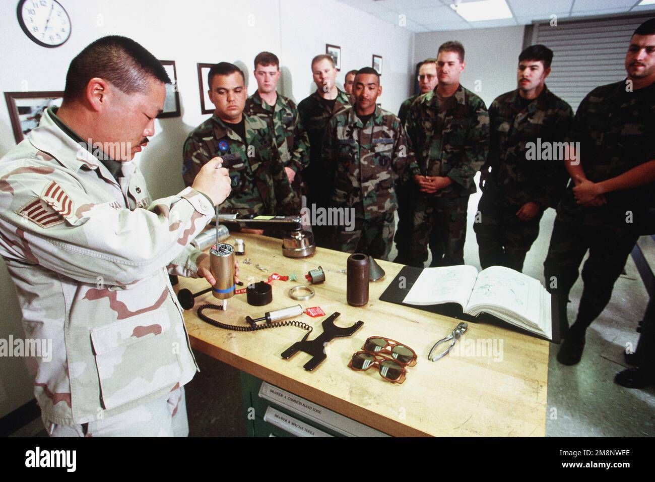 US Air Force Technical Sergeant Ricky Hamada goes over safety devices ...