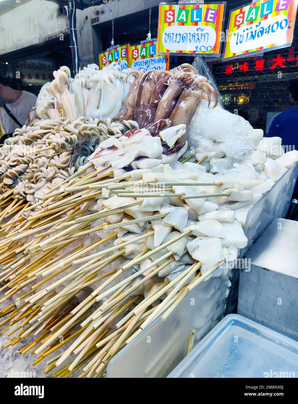 Bangkok food market, marine street food ,featuring a large stack of ...