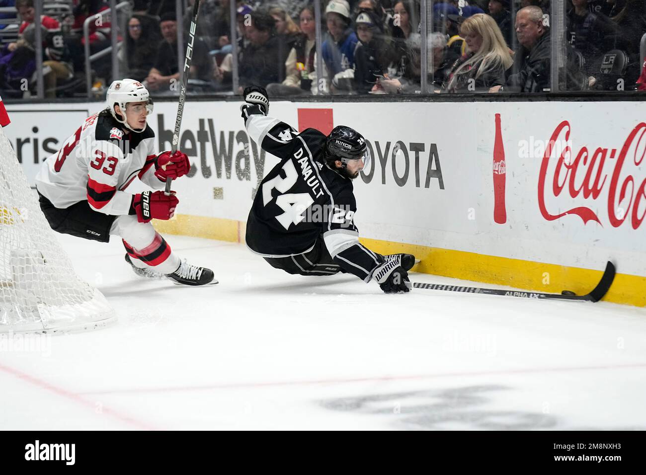 Los Angeles Kings center Phillip Danault, right, falls while under ...