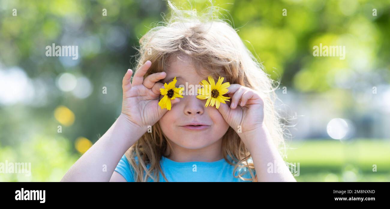 Close up face of cute child outdoors. Spring banner for website header ...