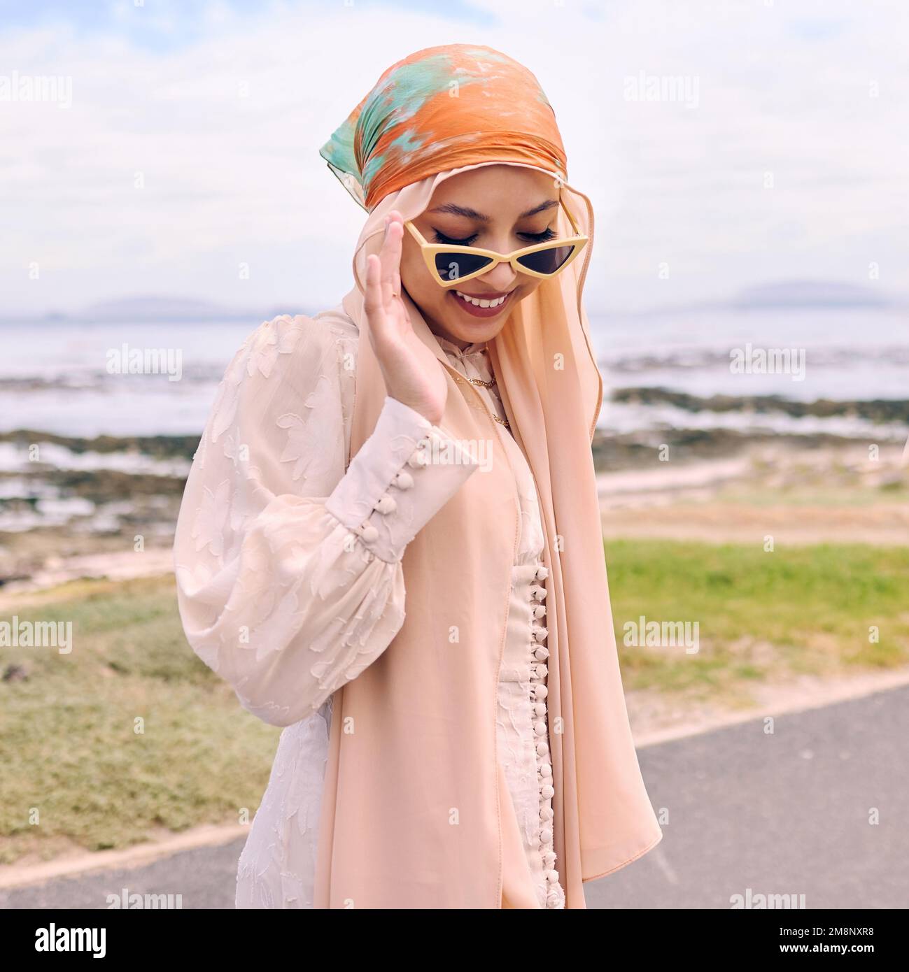 Beautiful young arab woman posing outdoors in a headscarf. Attractive ...