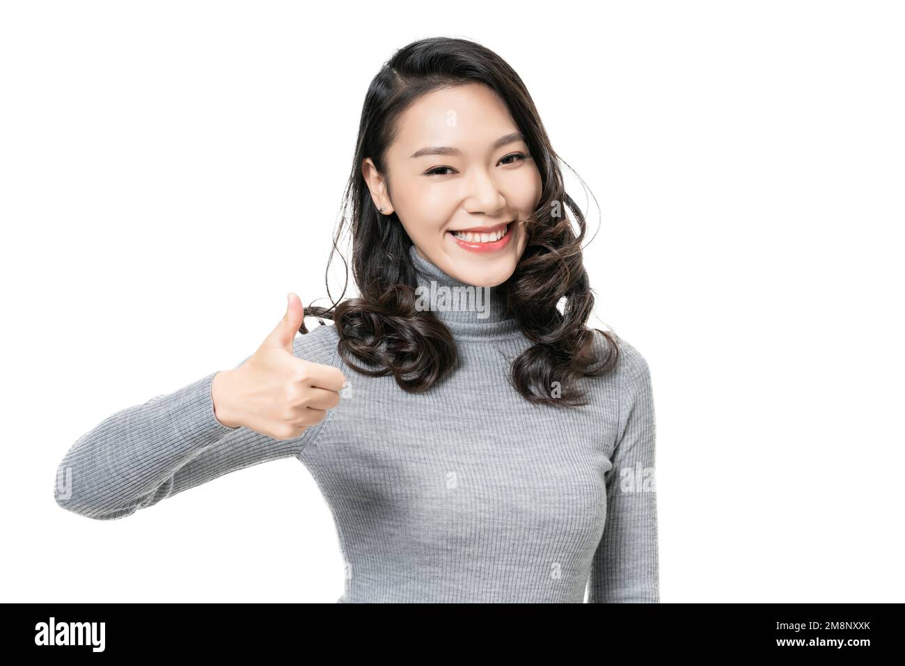 Young woman gestures thumb hi-res stock photography and images - Alamy