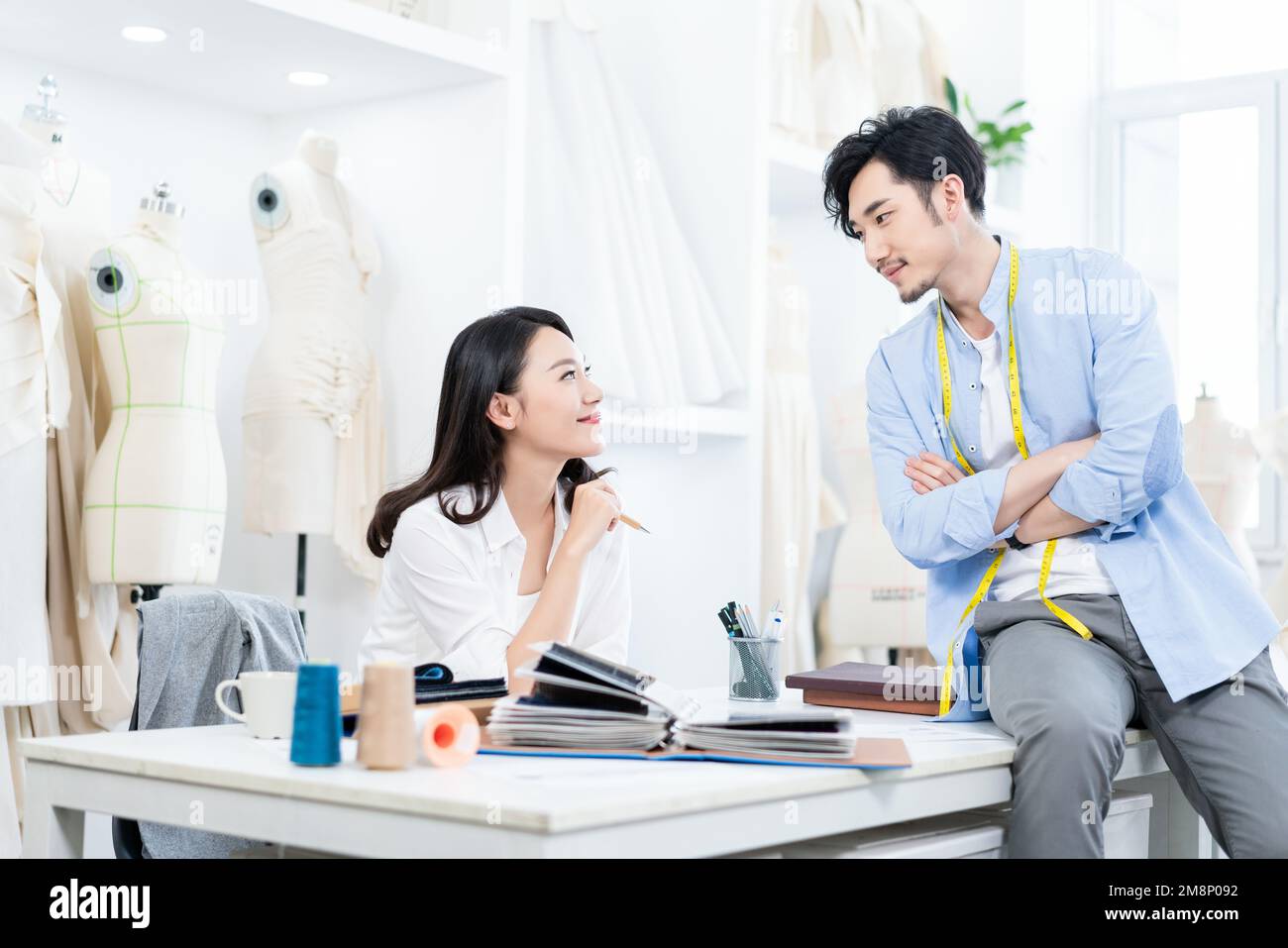 Two positive designers holding hi-res stock photography and images - Alamy