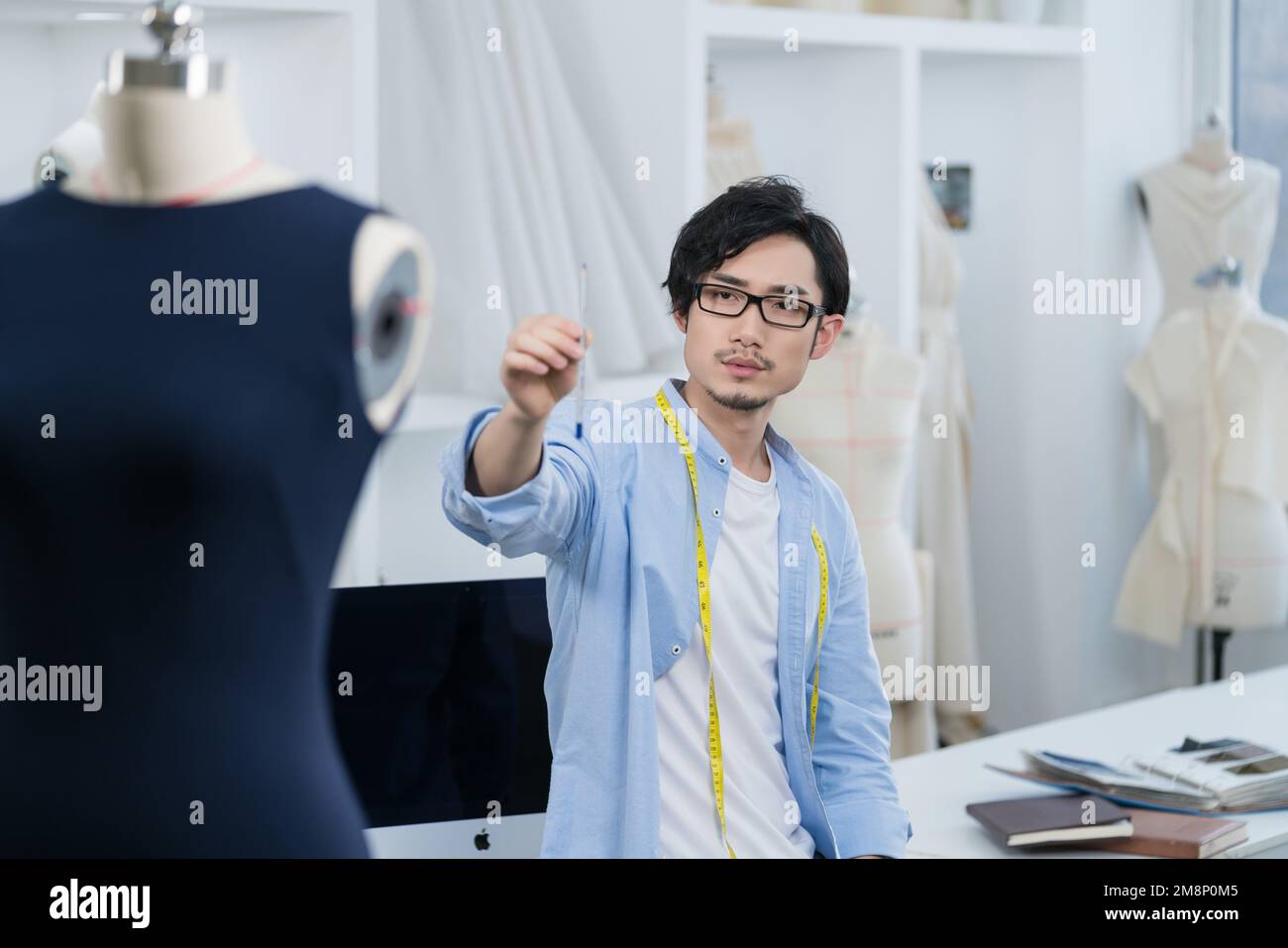 Serious young designer wearing hi-res stock photography and images - Alamy