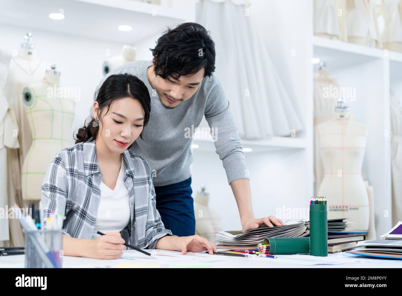 Two positive designers holding hi-res stock photography and images - Alamy