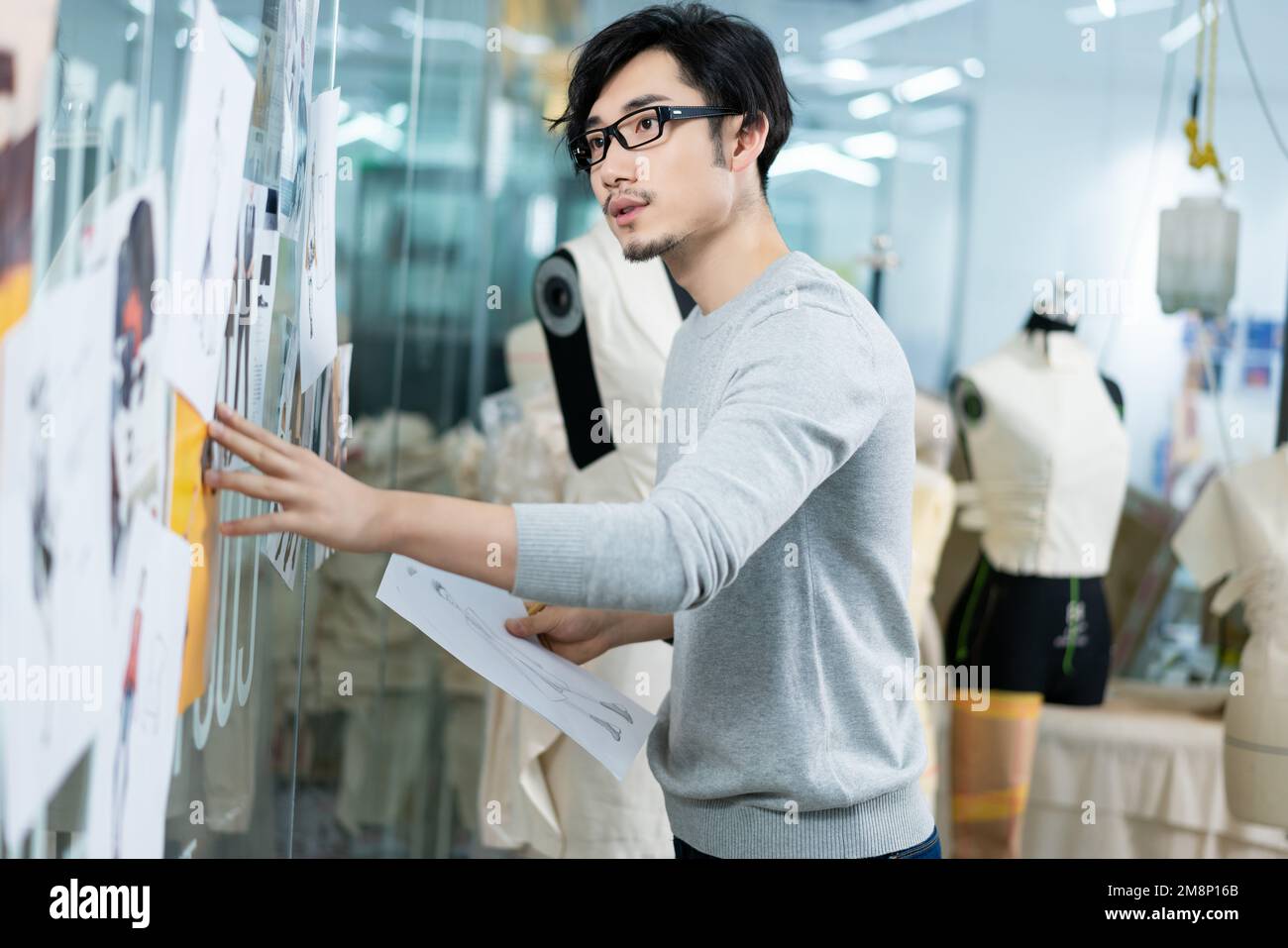 Fashion model fashion standing holding designer clothing hi-res stock photography and images - Alamy