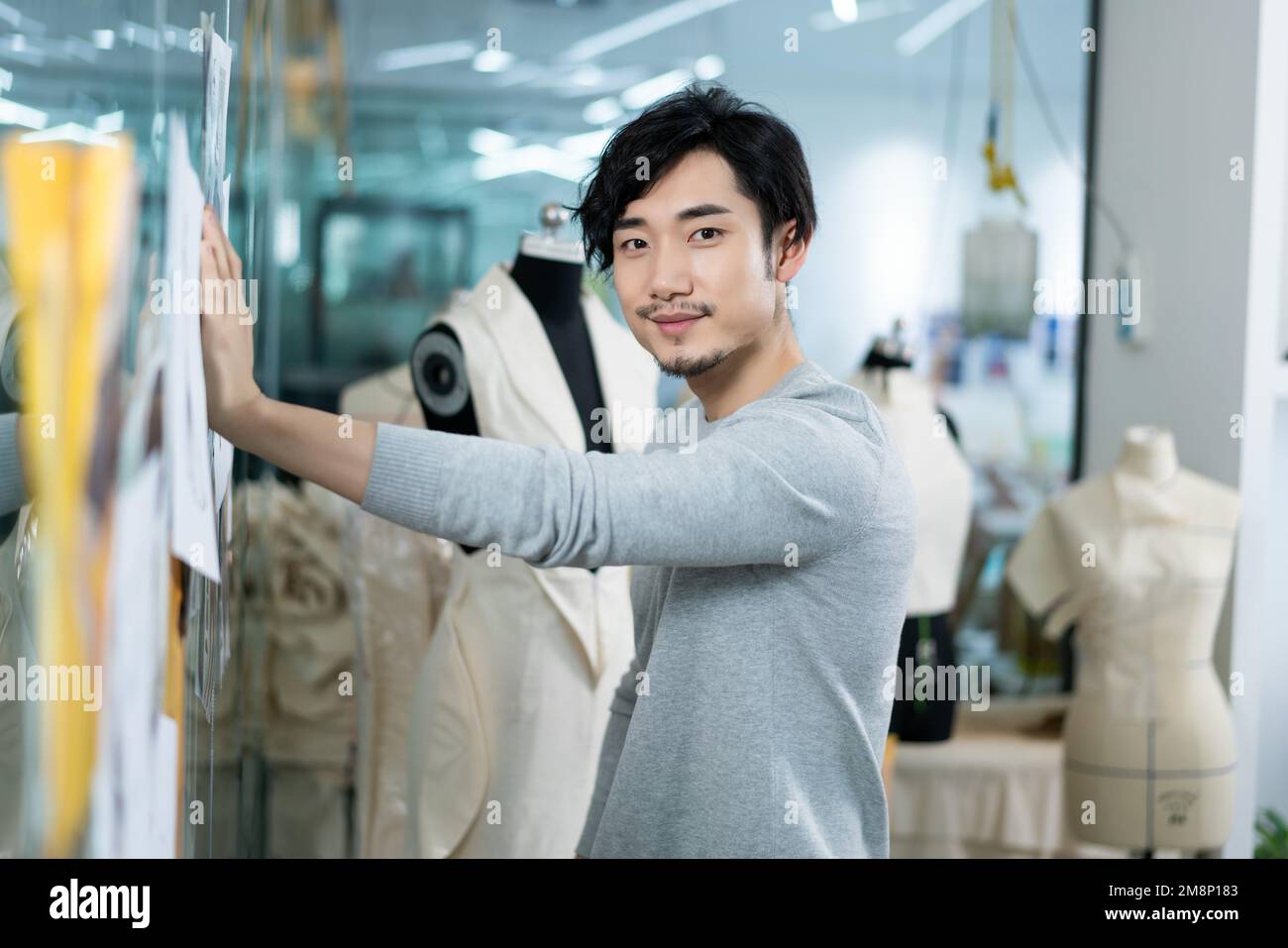 Fashion model standing designer clothing smiling hi-res stock ...