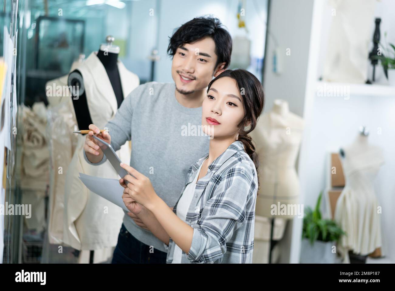 Two positive designers holding hi-res stock photography and images - Alamy