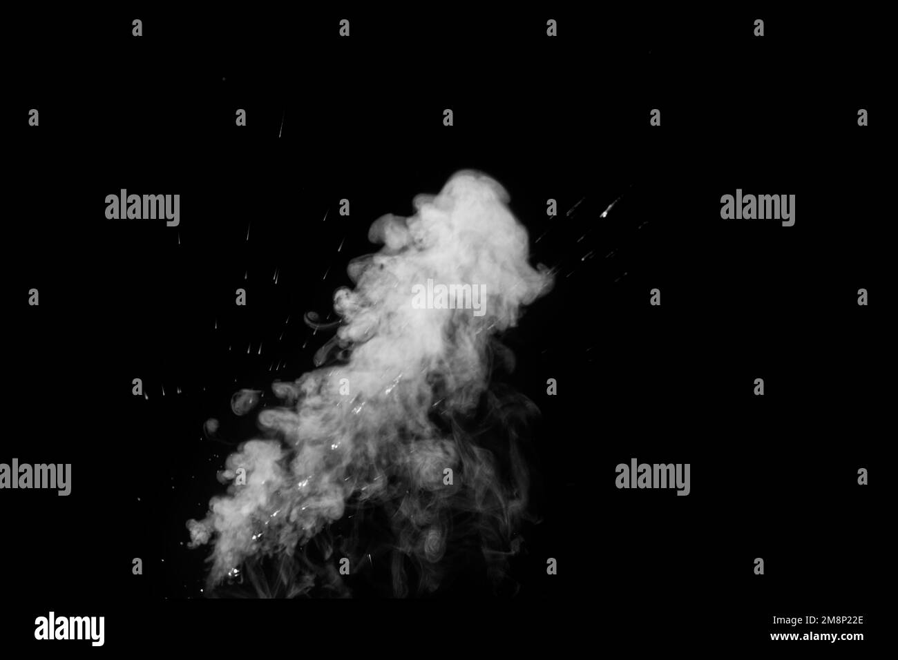 Close-up of white water vapor with water splashes flying in different ...