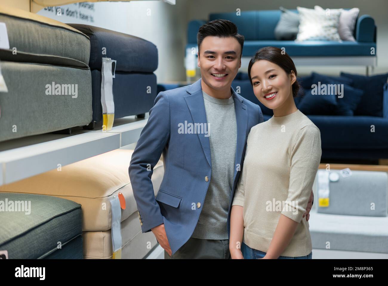 A young couple of choose and buy household items Stock Photo - Alamy