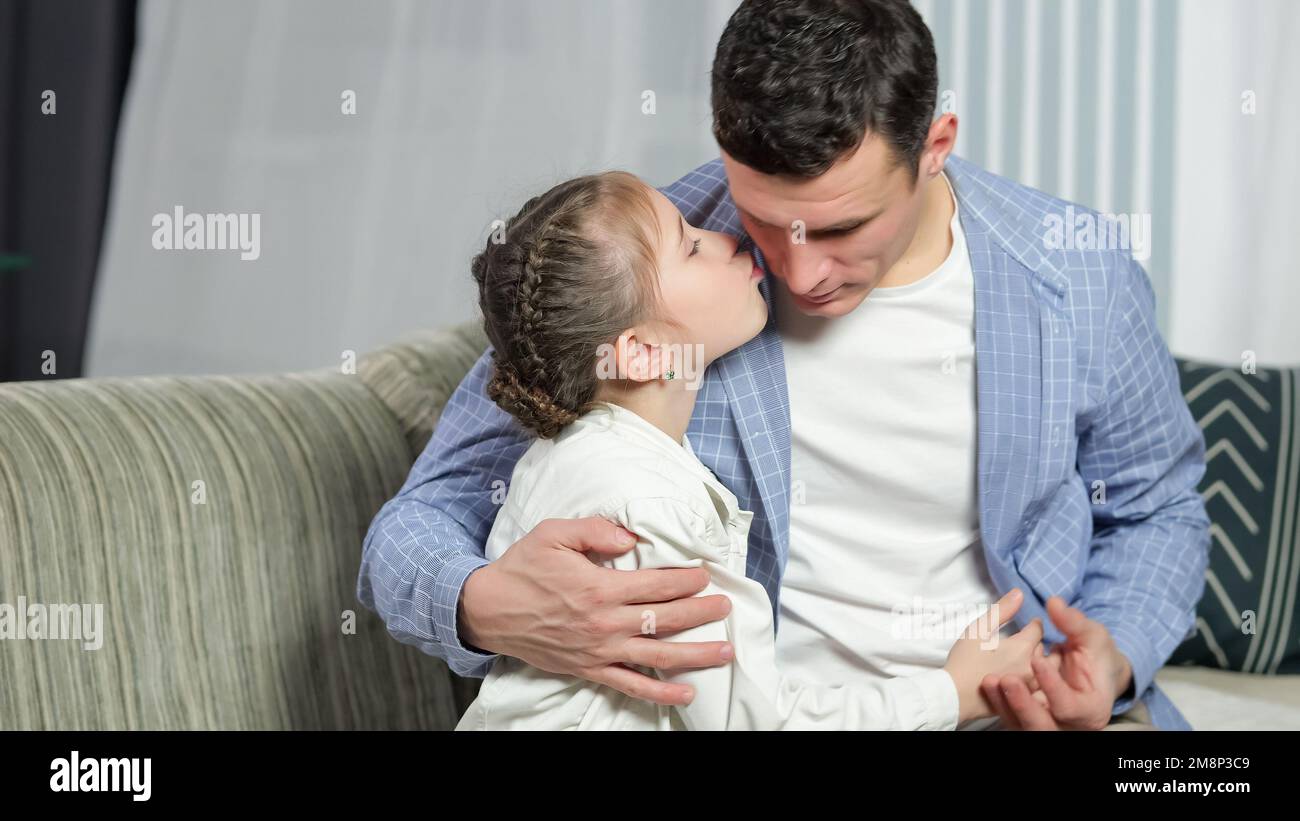 Loving father shows love and embraces precious daughter Stock Photo - Alamy