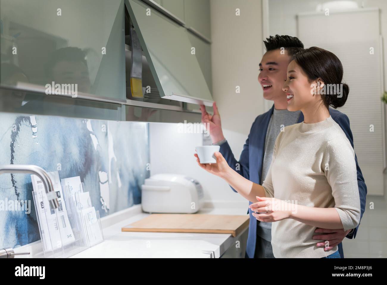 A young couple of choose and buy household items Stock Photo - Alamy