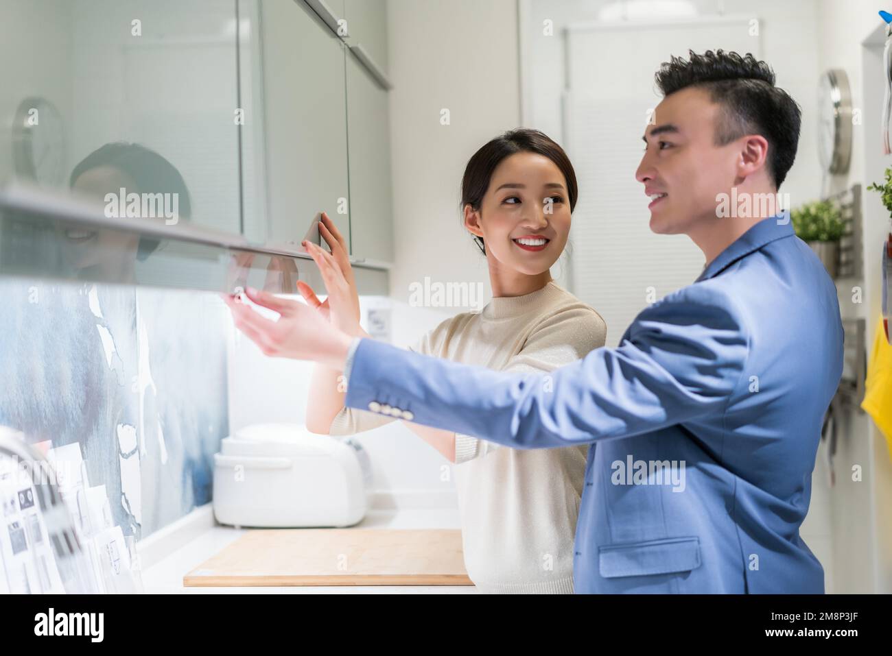 A young couple of choose and buy household items Stock Photo - Alamy