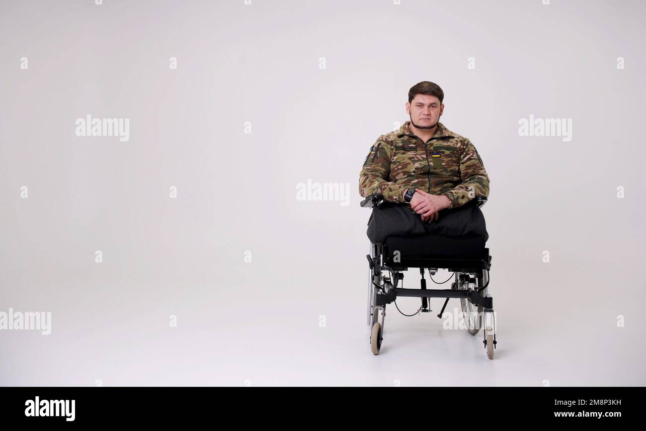 man in camouflage uniform soldier sitting in wheelchair and smiling at ...