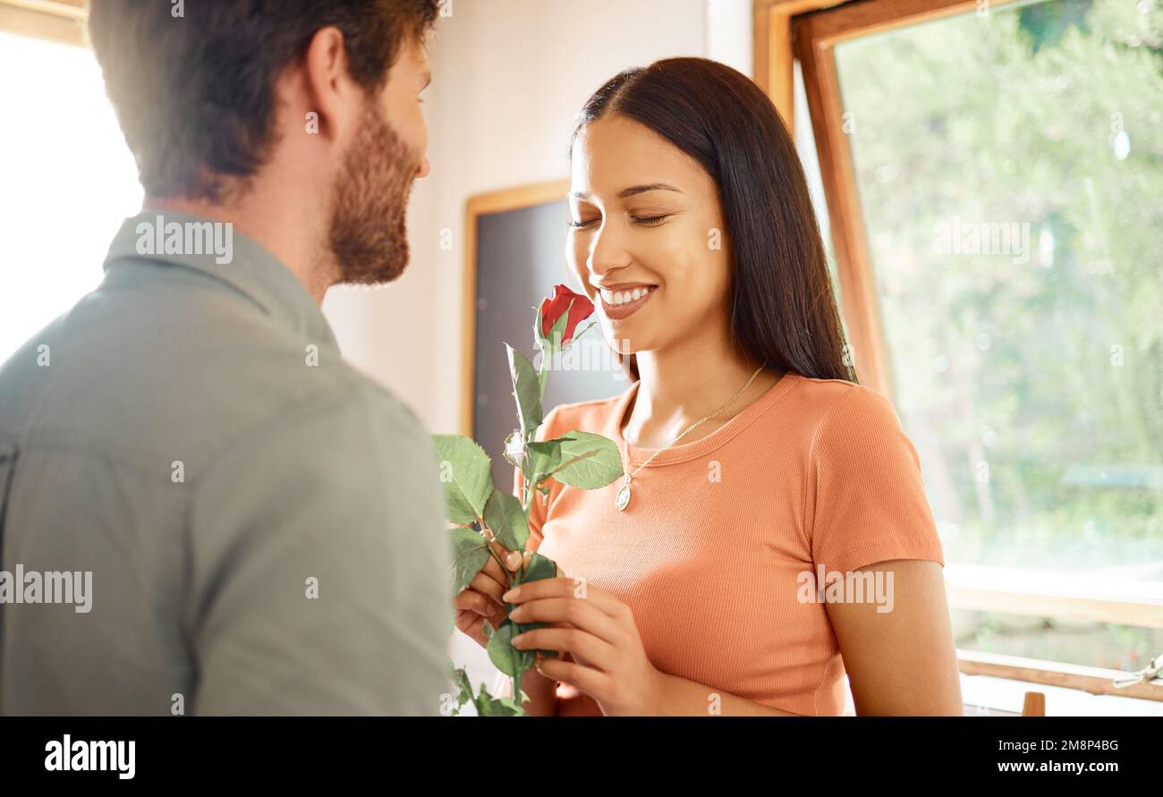 Young romantic caucasian boyfriend giving his mixed race girlfriend a ...