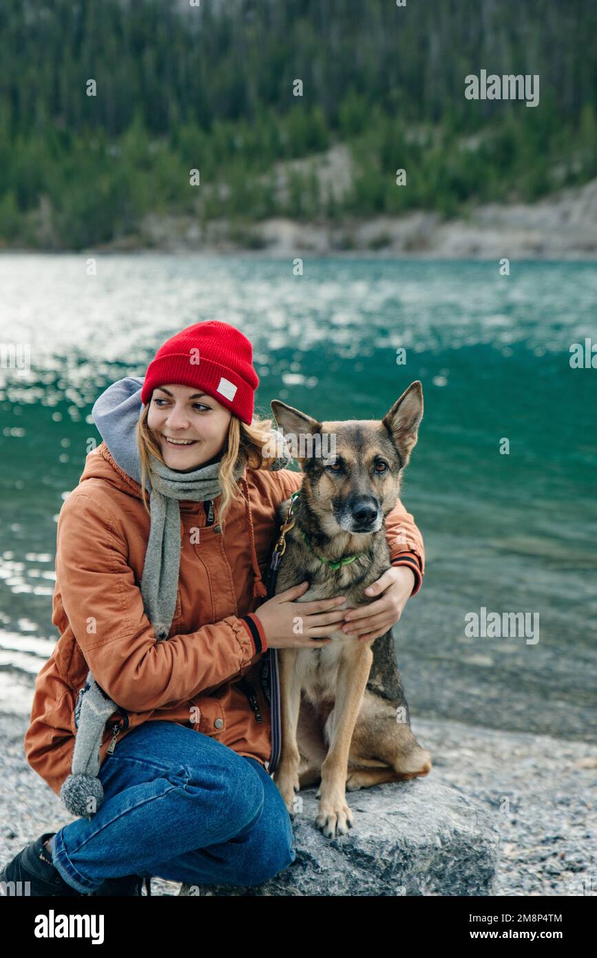 Human and a dog. female and her friend dog husky on the nature forests ...
