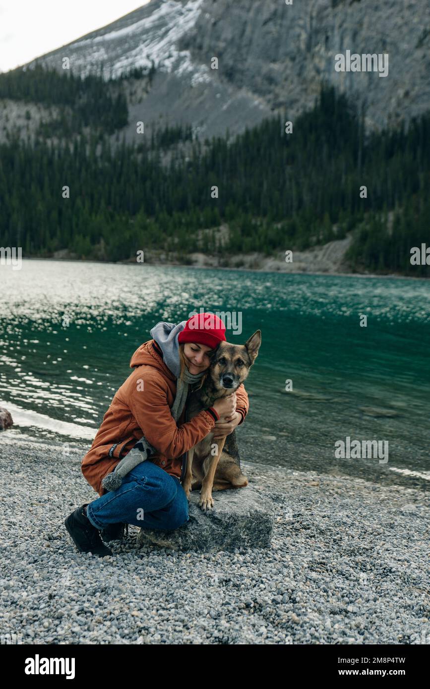Human and a dog. female and her friend dog husky on the nature forests ...