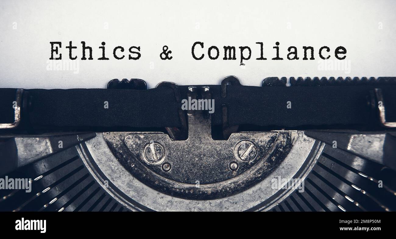 Ethics and compliance text typed on an old vintage typewriter ...