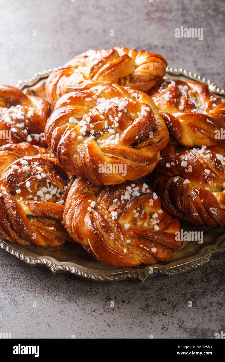 Kanelbullar Swedish cinnamon and cardamom buns with pearl sugar close ...