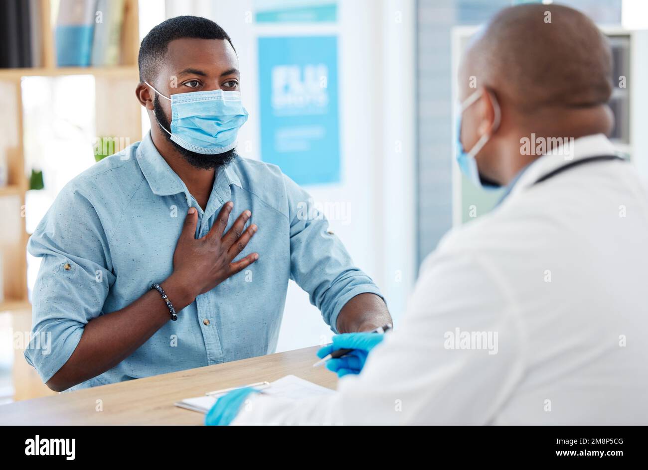 Patient talking to doctor about covid symptoms. African american man ...