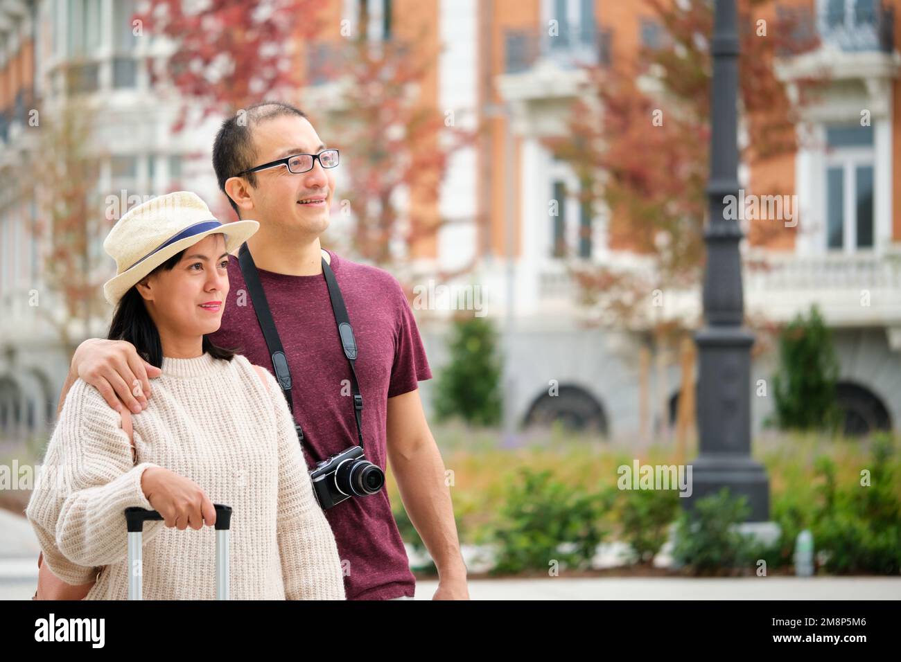 Multiracial couple of tourists exploring the city together Stock Photo ...