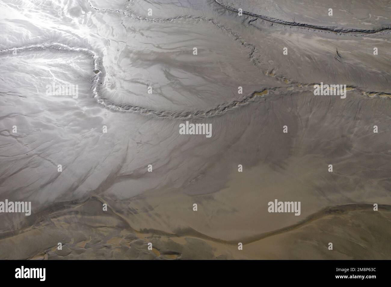 Aerial view of abstract muddy background. Decanting pond, copper mining ...