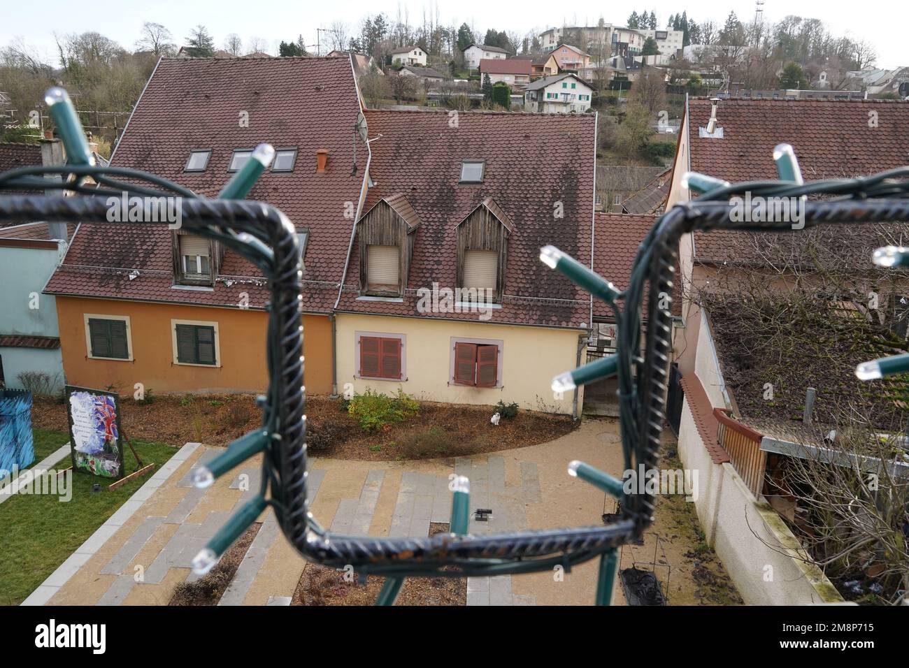 Light chain consisting of small bulbs connected with green cables ...